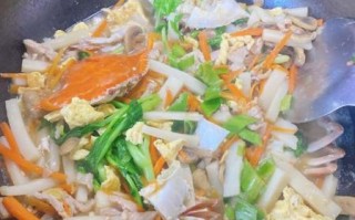 蟹炒年糕怎么做好吃_蟹炒年糕家常做法