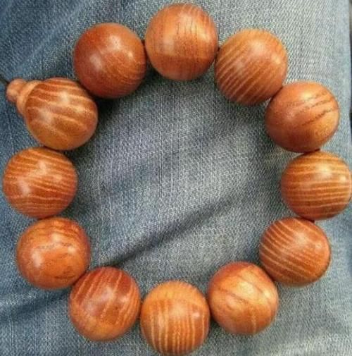 香椿木手串包浆图片_如何盘出玻璃底-第1张图片-山城妙识