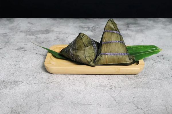 手拿粽子图片真实照片_如何拍得更诱人-第1张图片-山城妙识